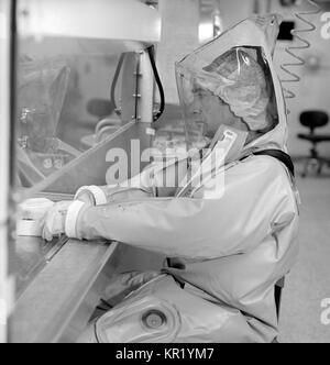 A CDC scientist conducts laboratory research in the Biosafety Level 4 ...