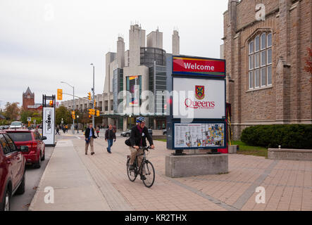 A Queen's University sign and the Joseph S Stauffer Library at Queen's ...