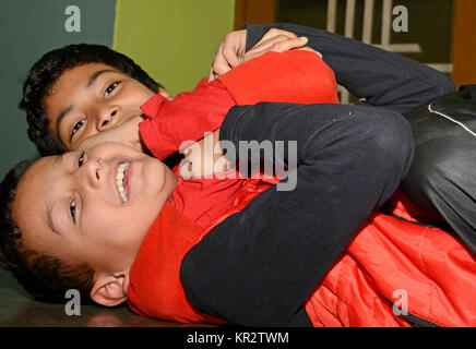 Two angry brothers fighting eachother Stock Photo - Alamy