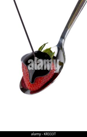 Closeup of a strawberry dripping chocolate syrup Stock Photo - Alamy