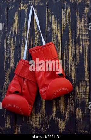 Boxing gloves hanging on nail on wall Stock Photo - Alamy