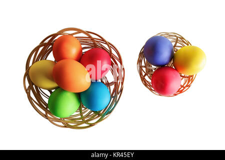 Wicker baskets with bright colorful eggs and with text Happy Easter and ...