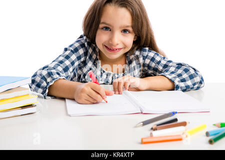 Little girl at school making drawings and painting Stock Photo - Alamy