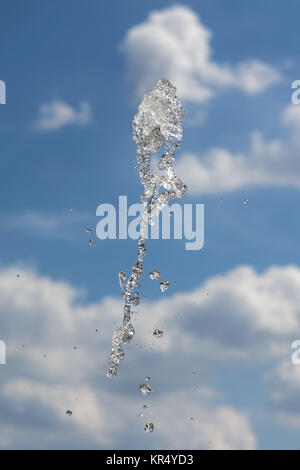 Splashes of water fountain movement of liquid flow against the dark ...