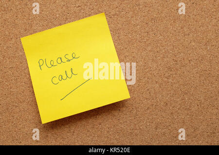 Yellow sticky note with Please Call written on it, stuck to an empty ...