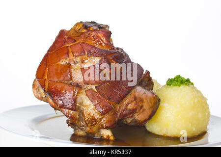 The traditional Bavarian dish of Schweinshaxe (roast pork knuckle) is ...