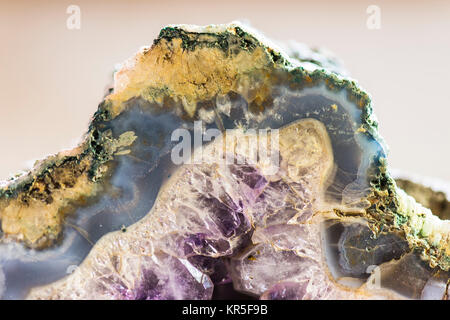 Amethyst geode close up of edge with crystals in background Stock Photo ...