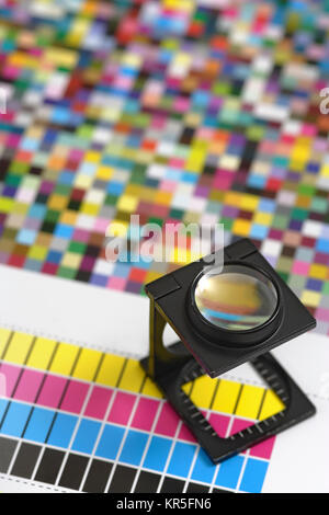 Printing loupe on proof CMYK color chart Stock Photo - Alamy