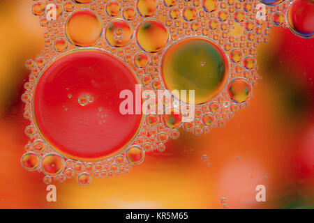 Abstract colorful backdrop with oil drops and waves on water surface ...