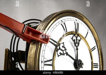 Clothespin stop the clock Stock Photo - Alamy