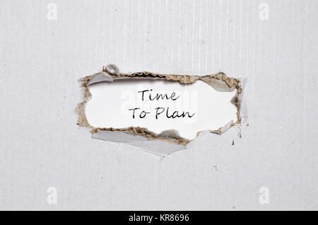 The words time to plan appearing behind torn paper Stock Photo - Alamy