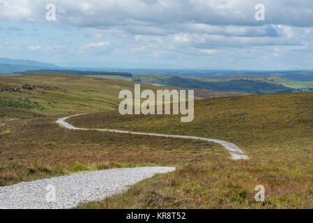 Ireland, Cavan County, Cuilcagh Mountain Park, Woman walking along ...