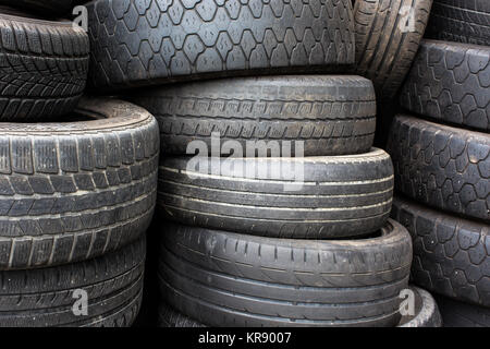 Stack stacks of new and used motor vehicle car van tyres tires stacked ...