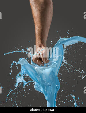 Punching Through Water - Close-up of a man s fist punching through ...