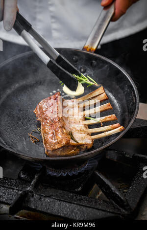 Racks of roasted lamb ribs with butter and rosemary Stock Photo - Alamy