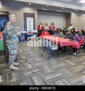 Division Chaplain (Lt. Col.) David Bowlus hugs his son Andrew, while ...