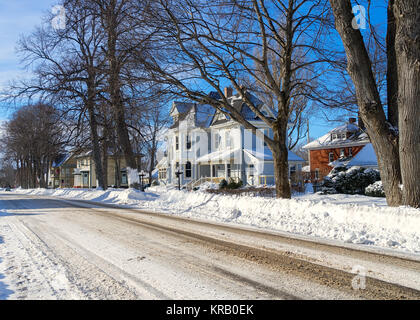 Older traditional house in wintertime in a North American neighborhood ...