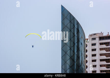 Yellow paraglider flying over Lima, Peru Stock Photo - Alamy