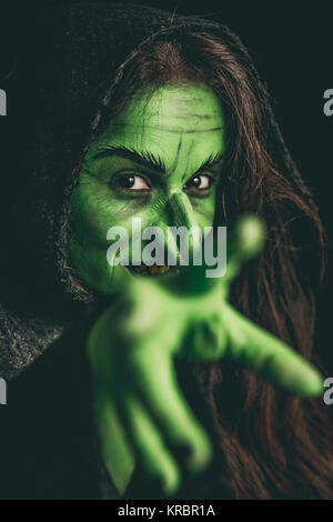 Evil witch casting a curse Stock Photo - Alamy