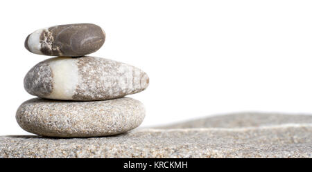stacked rounded stone pebble arrangement in white back Stock Photo - Alamy