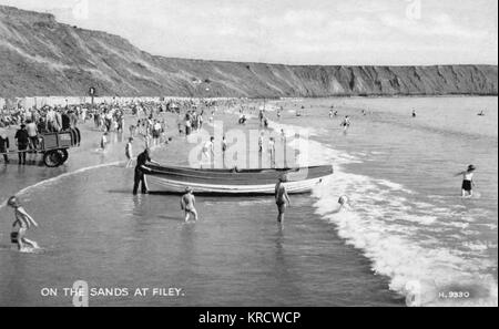 Holidaymakers on the sands at Filey, North Yorkshire -- the beach is ...