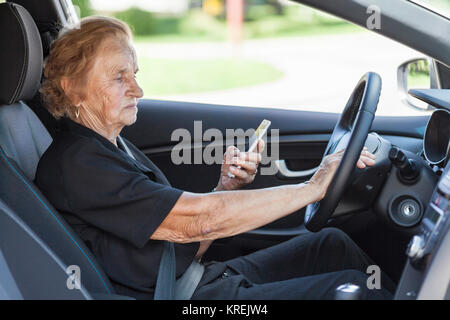 elderly woman driver at the steering wheel of a car Stock Photo - Alamy