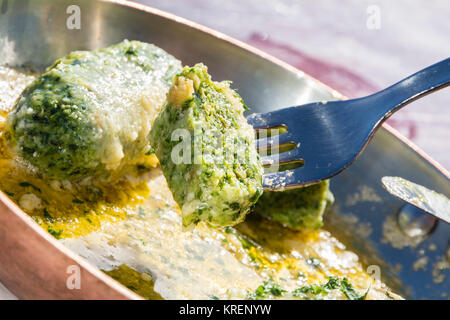 lunch at the alpine hut - spinach cakes and cheese socks Stock Photo ...