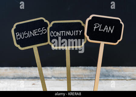Business continuity plan message written on wooden block with blue ...