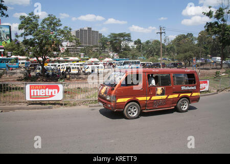 Brightly coloured traditional shared taxi or matatu buses in the ...