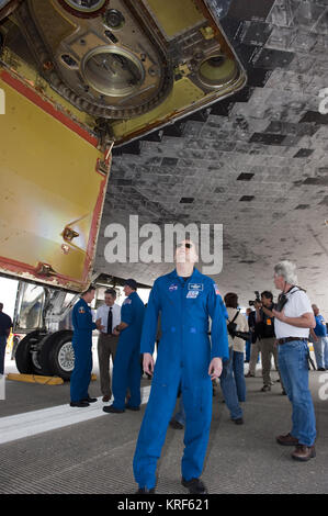 STS-133 pilot Eric Boe, front, and mission specialist Michael Barratt ...