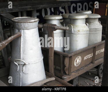 Old milk churns on a milk churn stand at a farm entrance Stock Photo ...