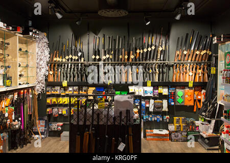 Interior of gunstore selling rifles, handguns and other firearms at ...