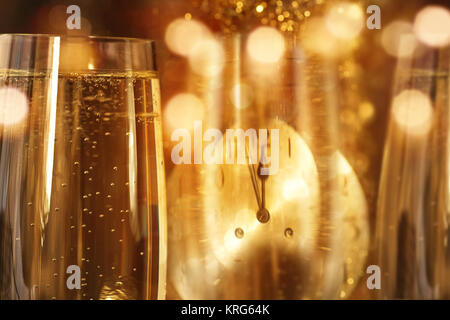 The clock with champagne Silvester new year party Stock Photo - Alamy