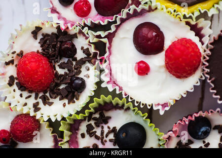 Colorful cupcakes with summer fruits in detail Stock Photo - Alamy