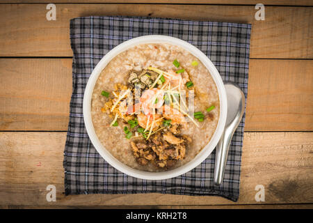 Mush rice on wooden Stock Photo - Alamy