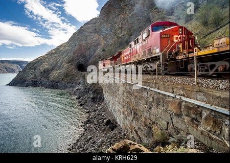 A CPR (Canadian Pacific Railway freight train winds it way through the ...