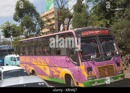 Brightly coloured traditional shared taxi or matatu buses in the ...