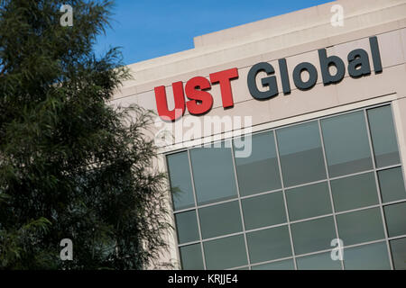 A logo sign outside of the headquarters of UST Global in Aliso Viejo ...