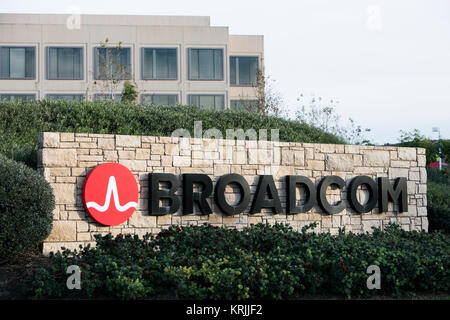 A logo sign outside of the headquarters of the Broadcom Corporation in ...