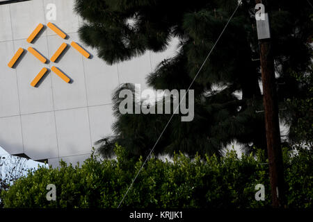 A logo sign outside of the headquarters of Faraday Future in Gardena ...