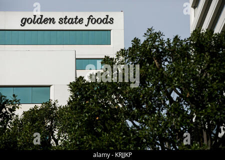 A logo sign outside of the headquarters of Golden State Foods in Irvine ...