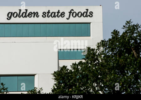 A logo sign outside of the headquarters of Golden State Foods in Irvine ...