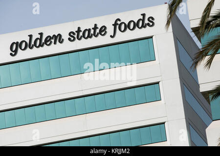 A logo sign outside of the headquarters of Golden State Foods in Irvine ...