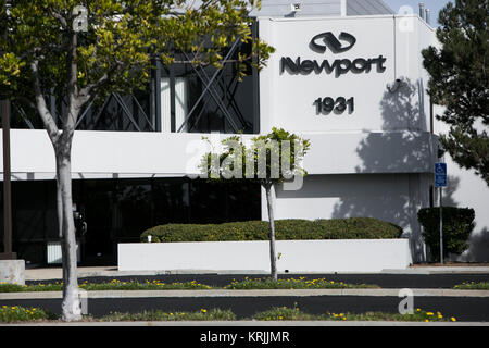 A logo sign outside of the headquarters of the Newport Corporation in ...