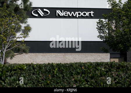 A logo sign outside of the headquarters of the Newport Corporation in ...