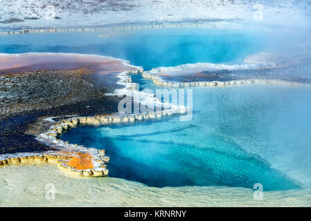 Beautiful clear, blue pool and steam from a hot spring at Excelsior ...