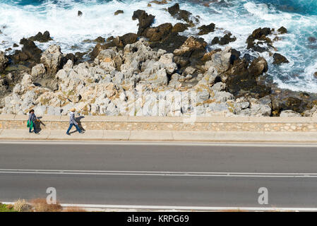 Waves breaking on a stony beach Stock Photo - Alamy
