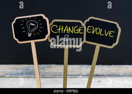 Concept message CHANGE AND EVOLVE and light bulb as symbol for idea ...