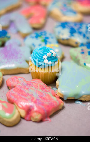 Christmas cookies and a cupcake layed out on table Stock Photo - Alamy