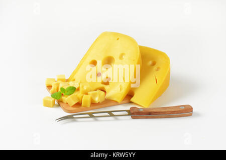 Wedges and cubes of Swiss cheese Stock Photo - Alamy